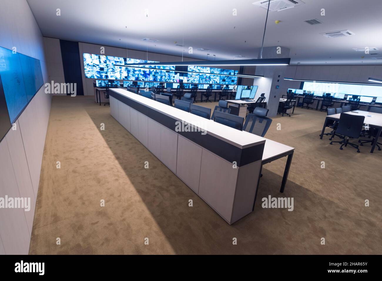 Security guard monitoring modern CCTV cameras in surveillance room ...