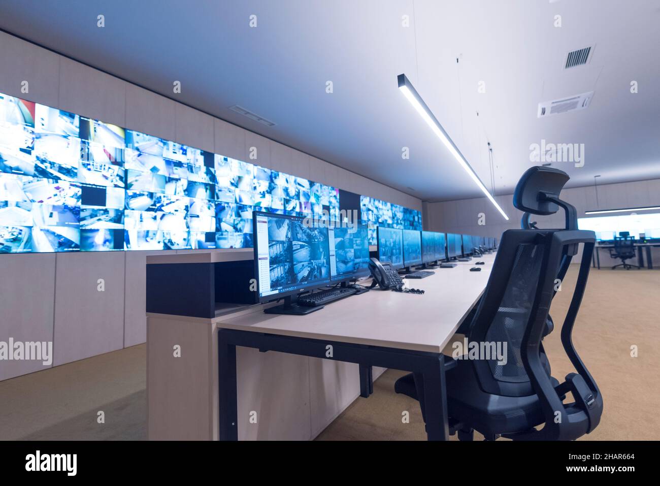 Security guard monitoring modern CCTV cameras in surveillance room ...