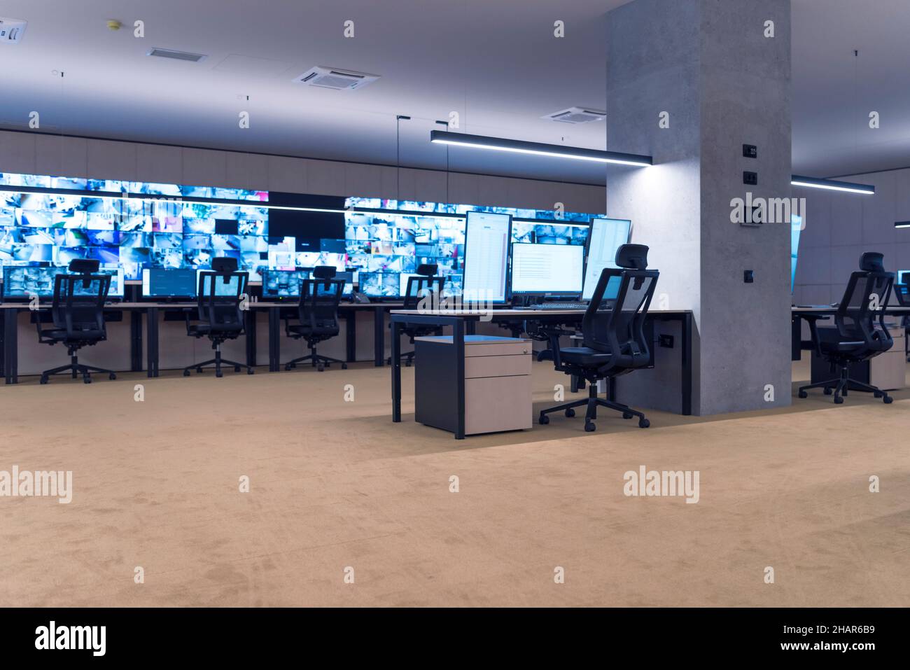 Security guard monitoring modern CCTV cameras in surveillance room ...