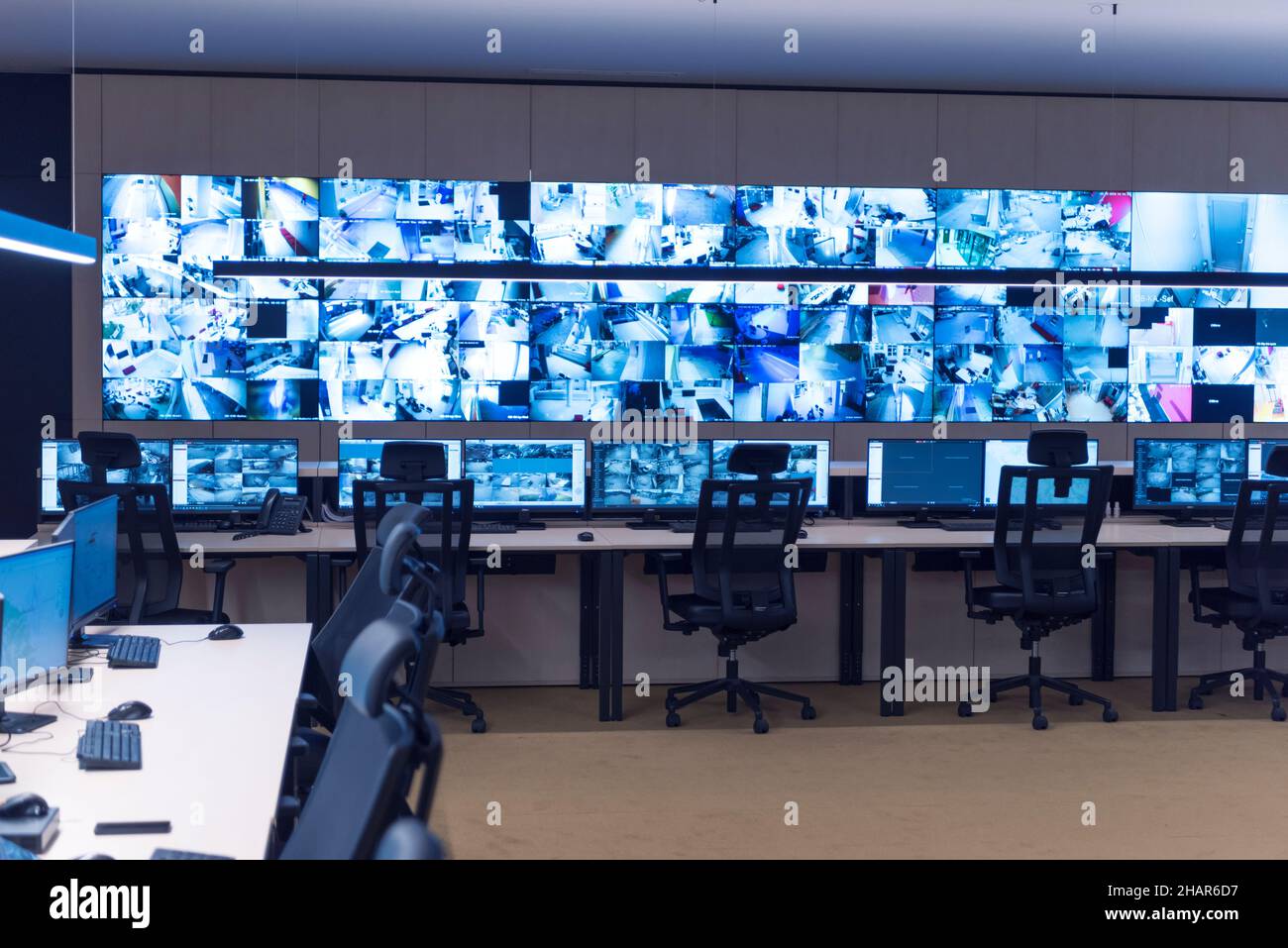 Security guard monitoring modern CCTV cameras in surveillance room ...