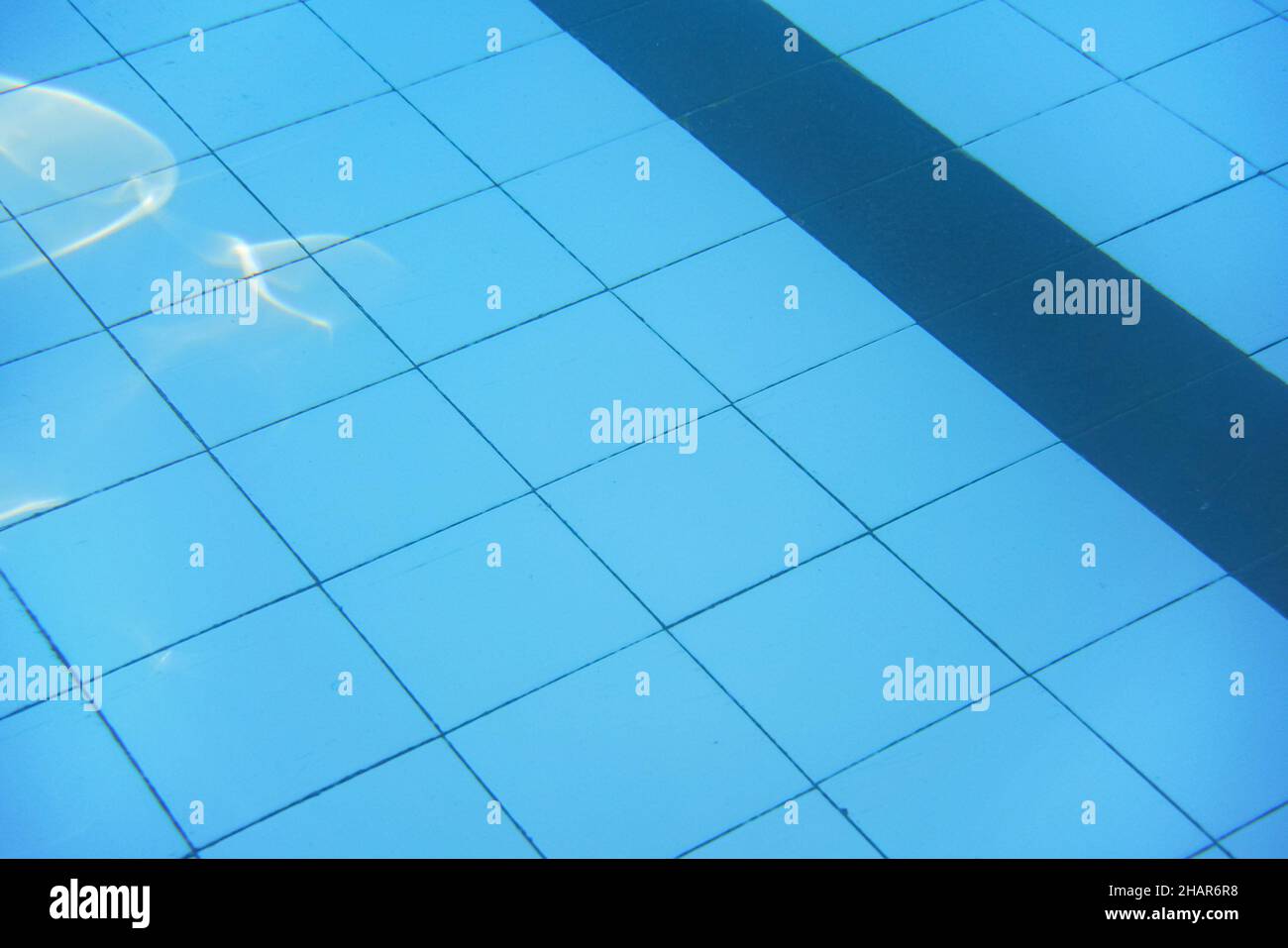 Calm water on empty swimming pool, dark lanes marks visible floor Stock ...