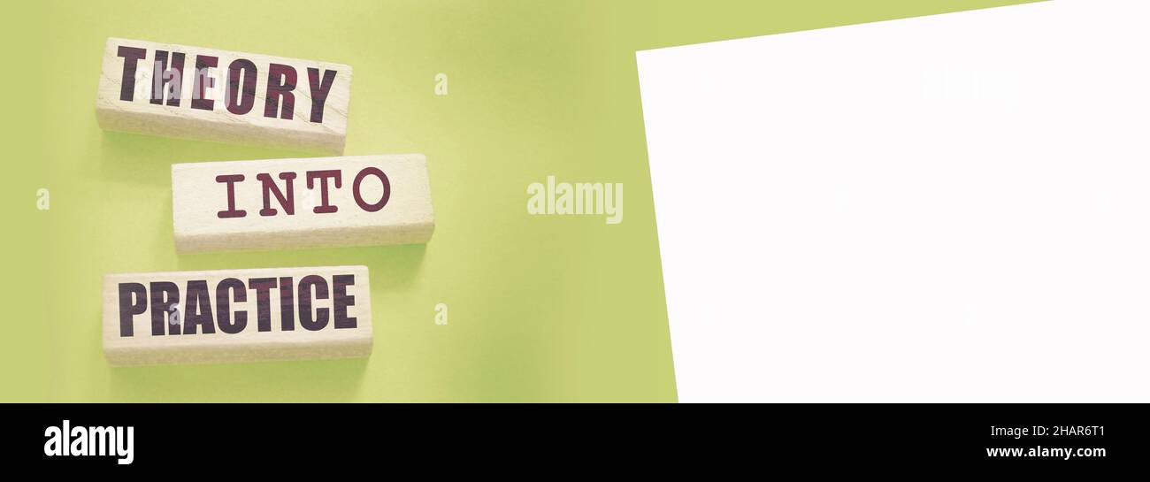 Theory into practice words written on wooden blocks. Education or ...