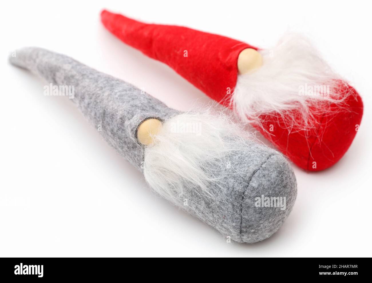 Two different color Santa clauses over white background Stock Photo - Alamy