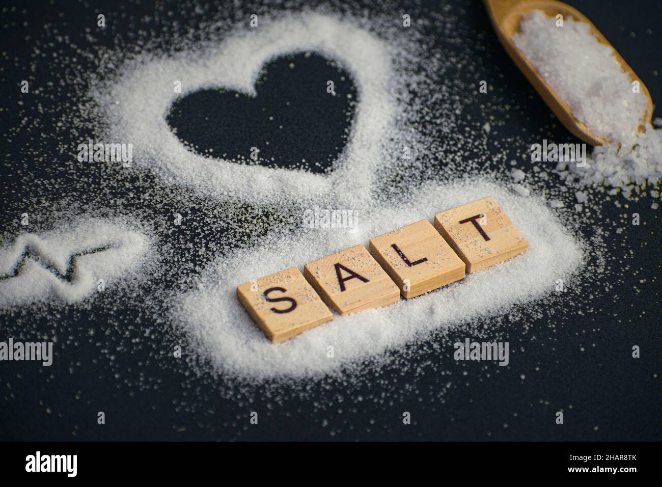 heart shape made with salt and salt inscription from boards. Concept ...