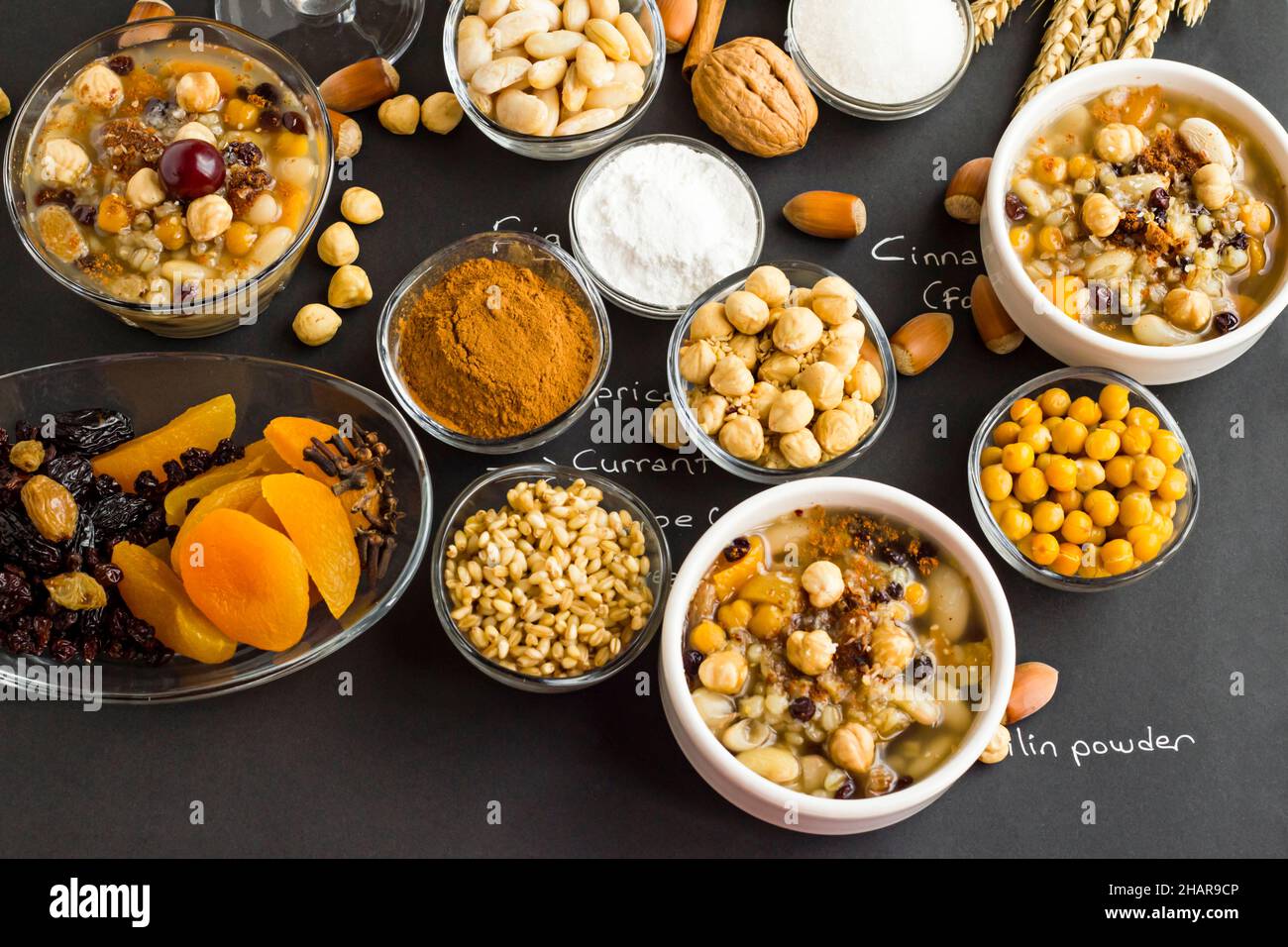 Traditional Turkish Dessert Asure in bowls on black background with all ...