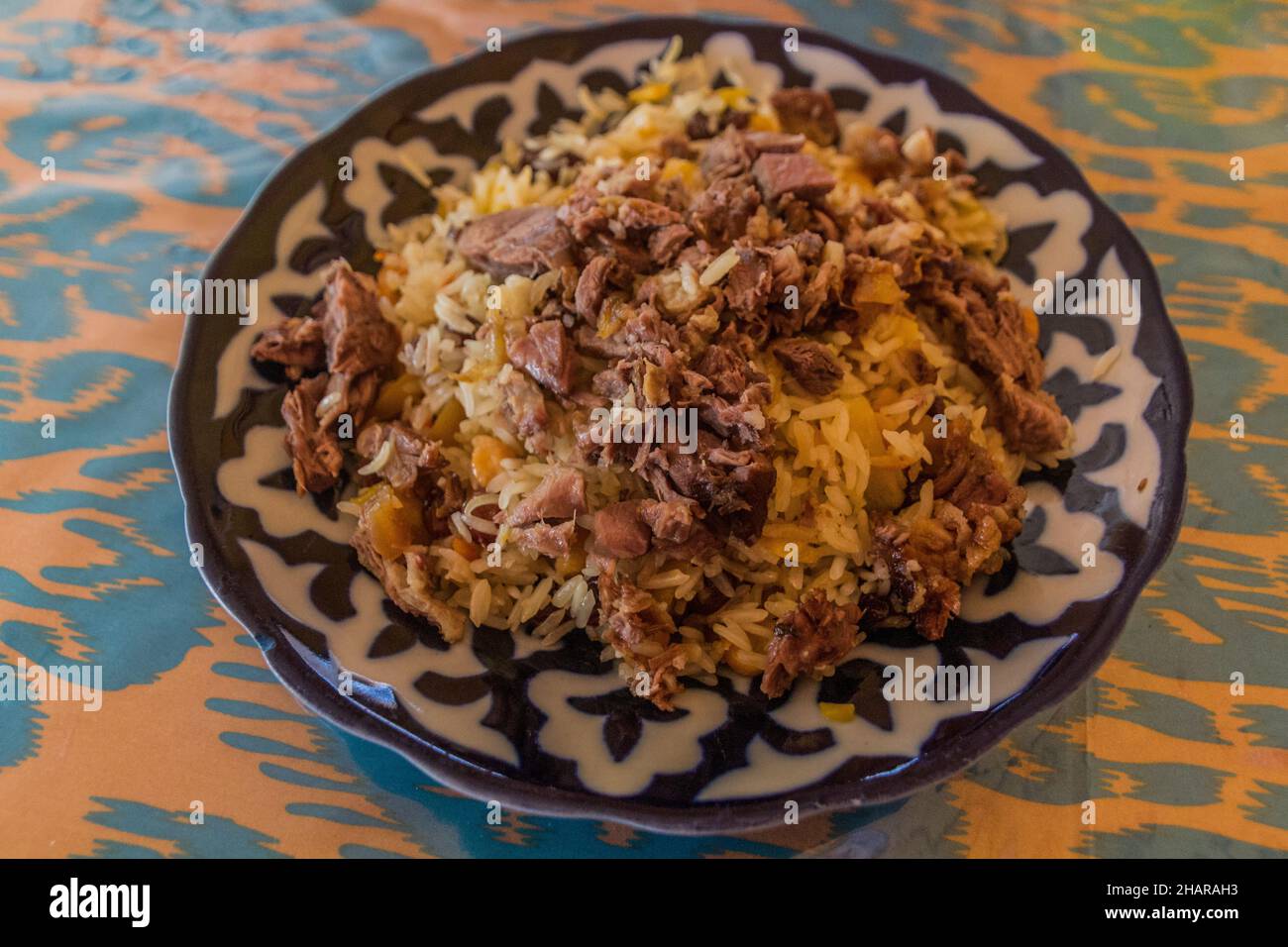 Plate of plov, rice meal of Central Asia Stock Photo - Alamy