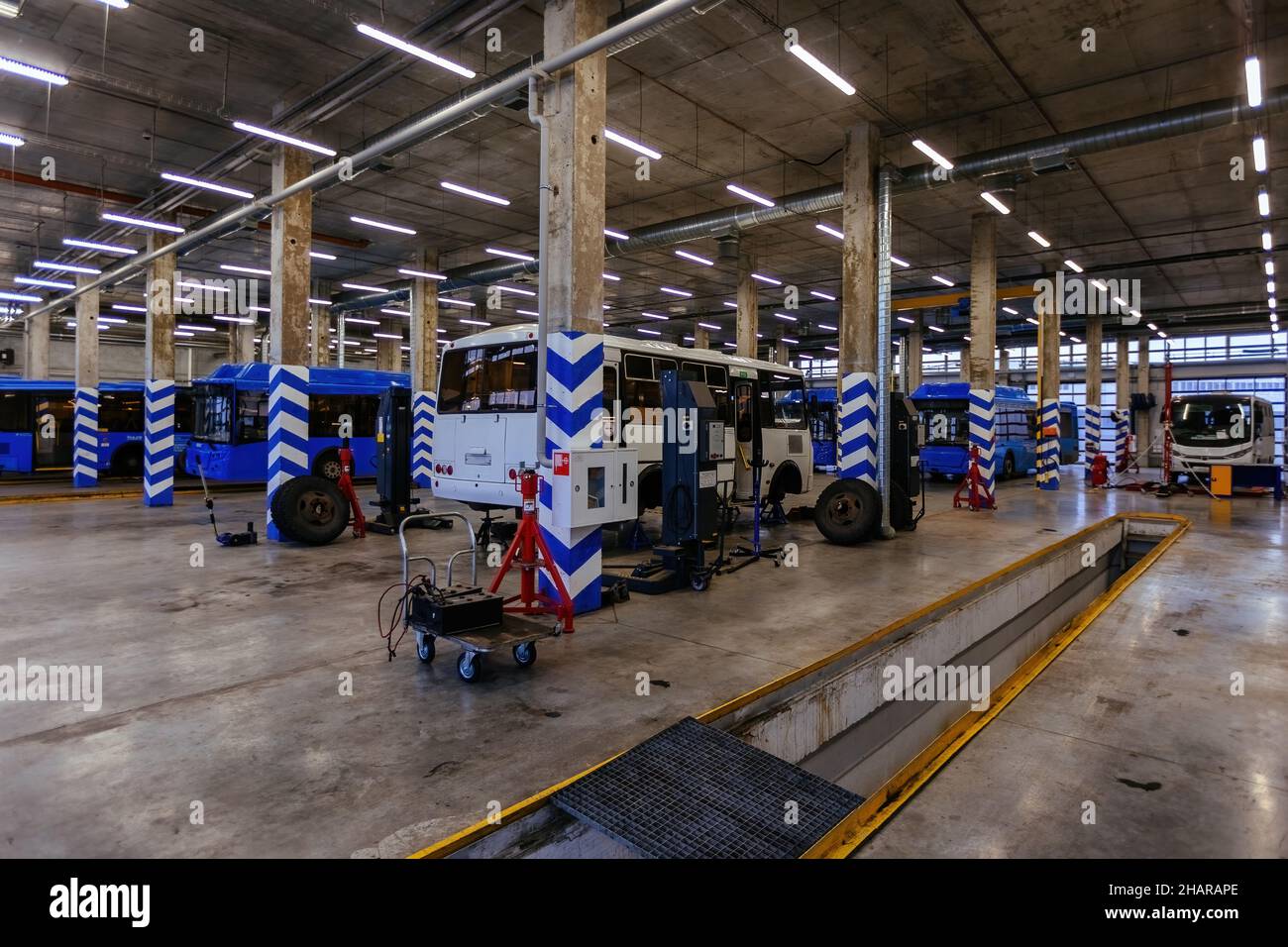 Buses in the modern repair service workshop Stock Photo - Alamy