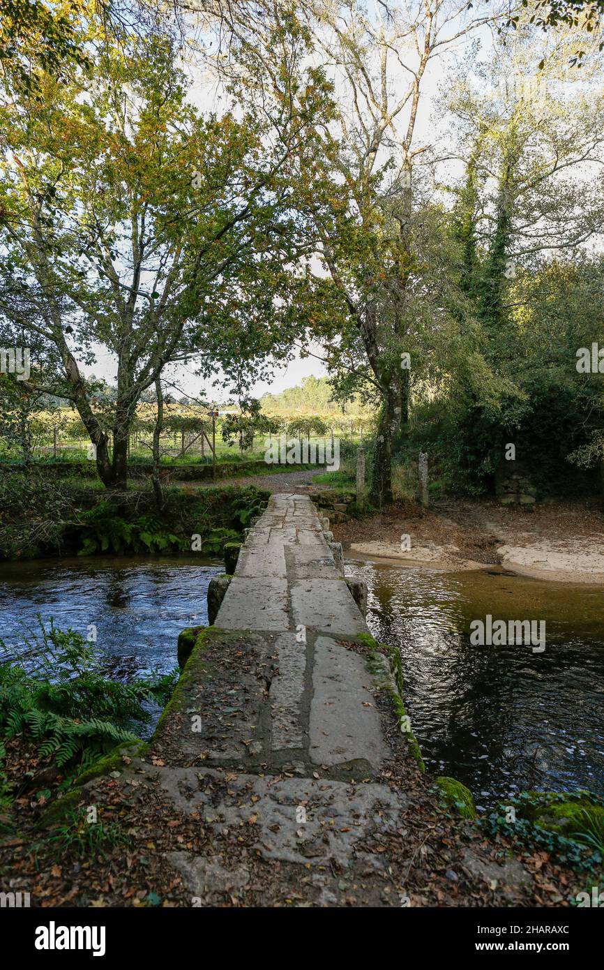 Stone bridge over the small river in a park Stock Photo - Alamy