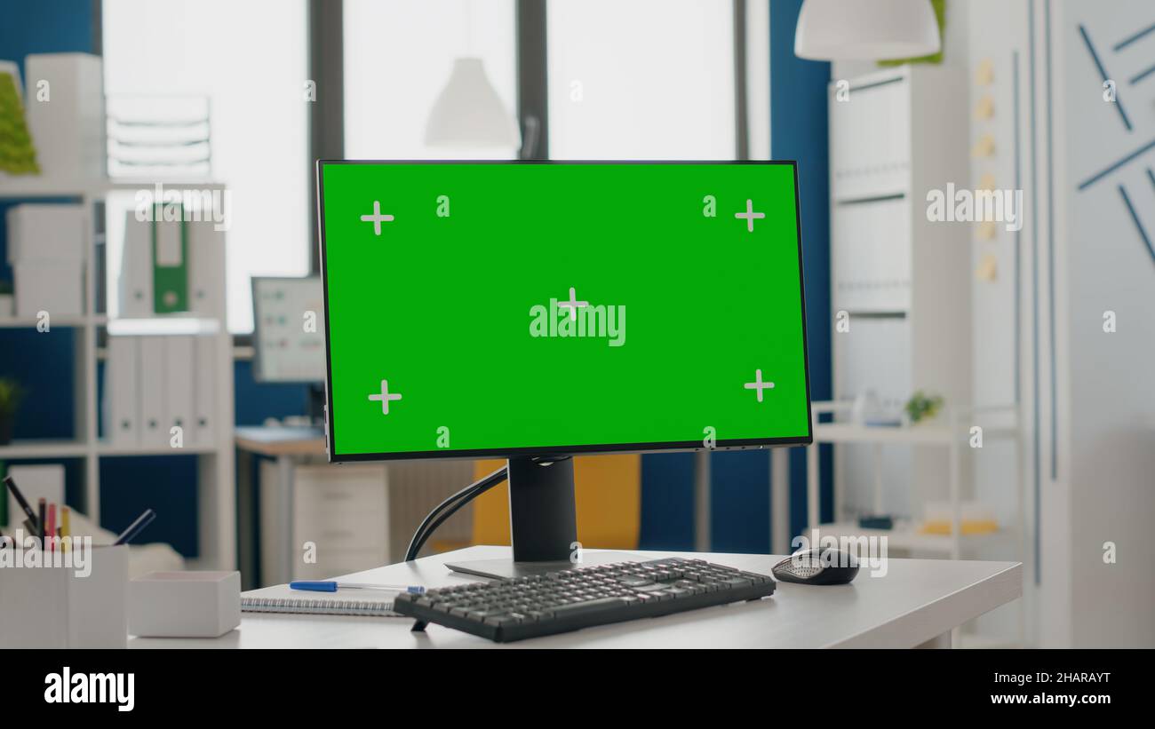 Close up of green screen on computer in empty business office. Isolated ...