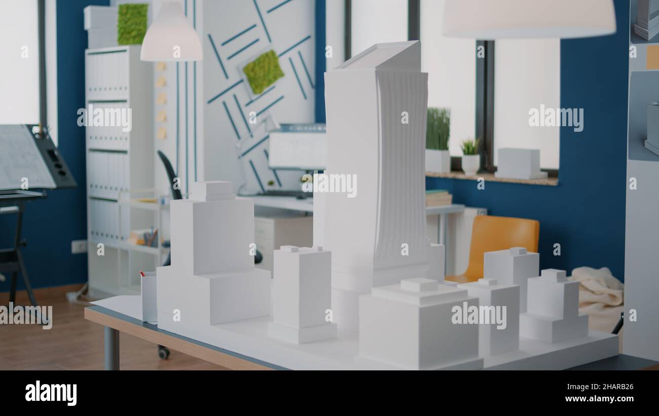 Concept of building model and construction design on table in empty ...