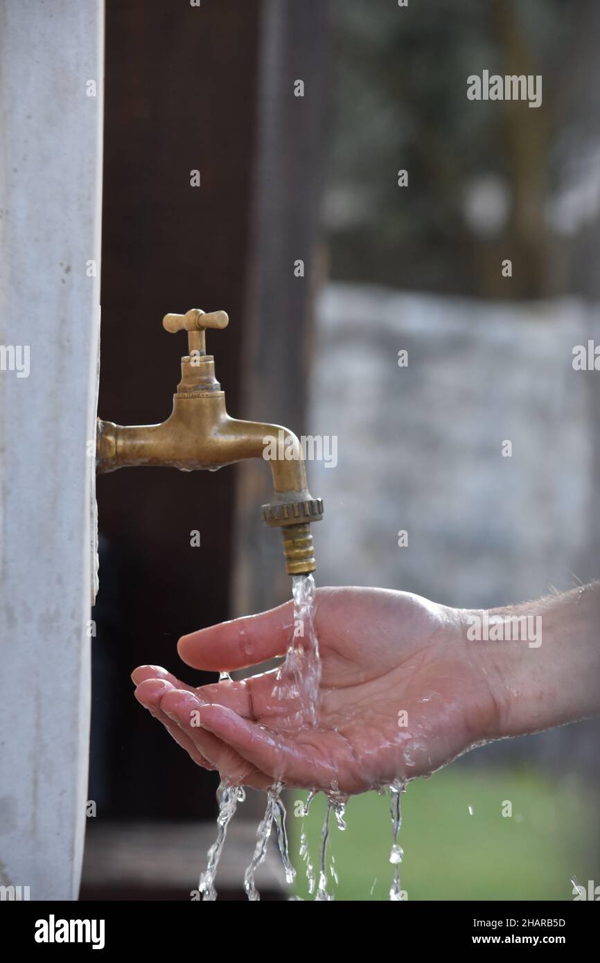 Hand flowing water hi-res stock photography and images - Alamy