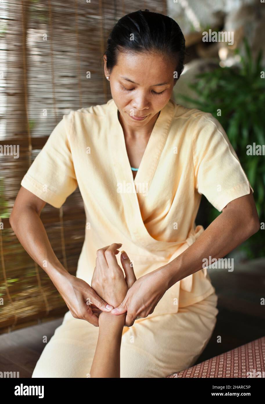 Woman Receiving Hand Massage at Kamalaya, Koh Samui, Thailand. A woman ...