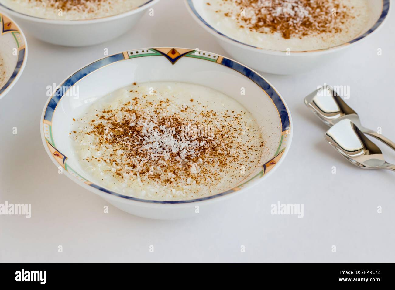 Traditional Turkish Rice Pudding,Sutlac in stylish bowls on white with ...