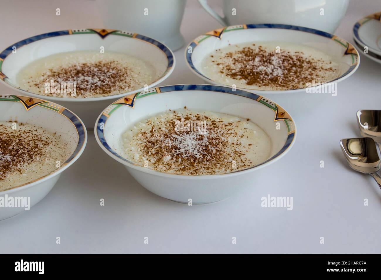 Traditional Turkish Rice Pudding,Sutlac in stylish bowls on white with ...