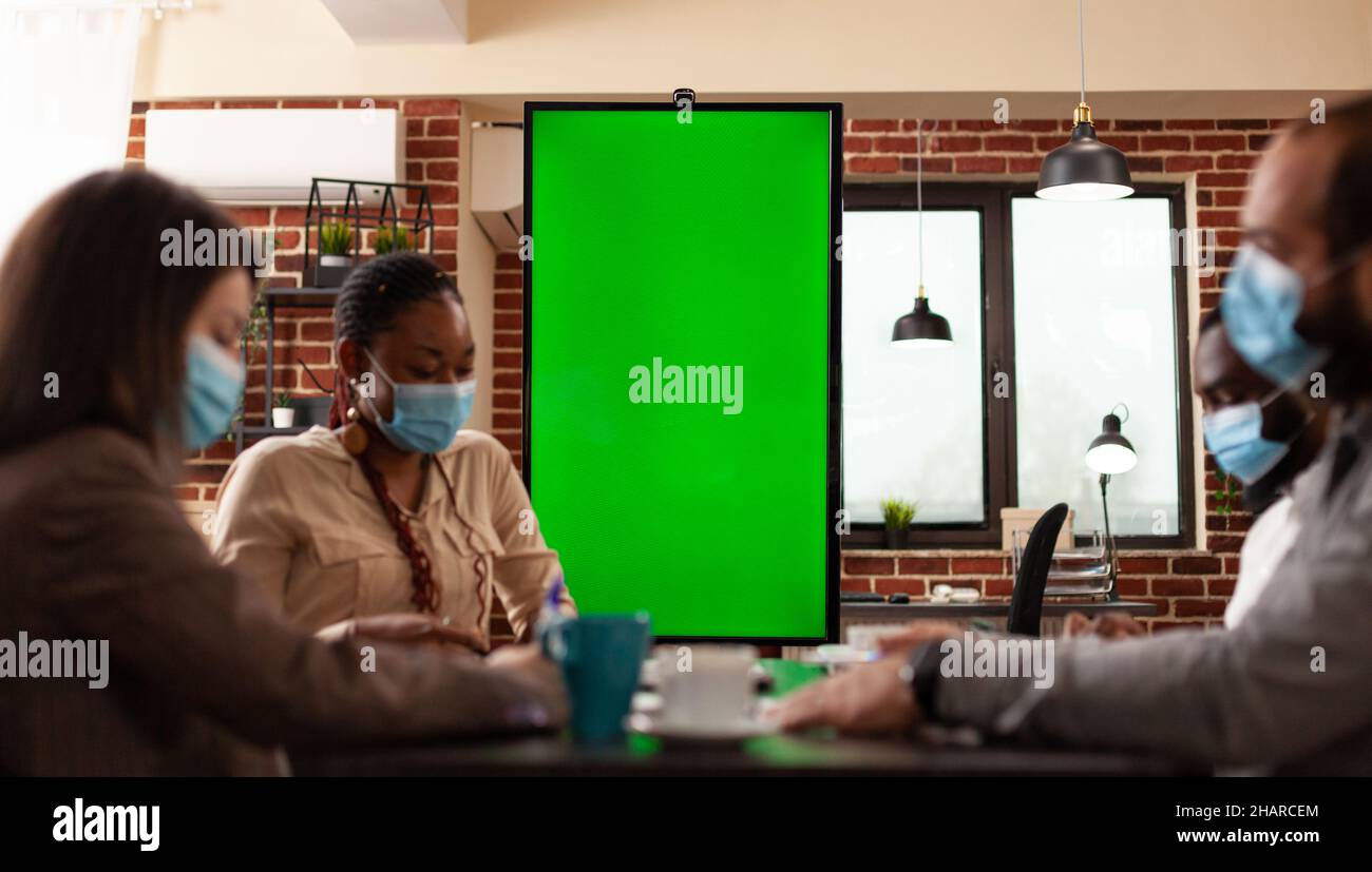 Multiethnic teamwork with medical protective face mask against ...