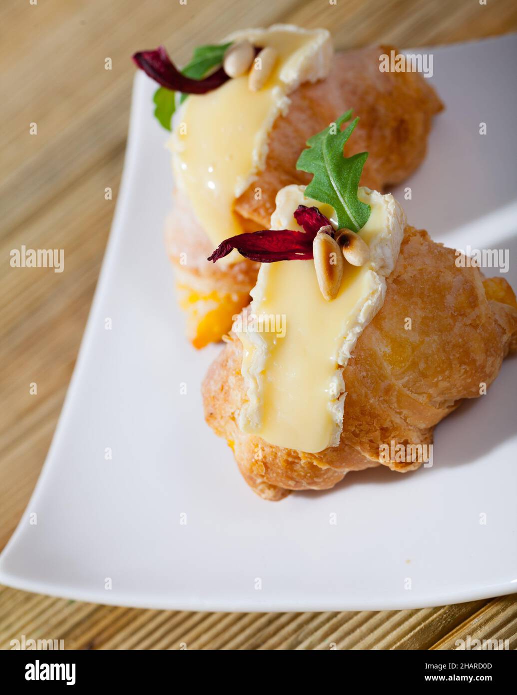 Dessert of french cuisine, mini croissant with camembert cheese Stock ...