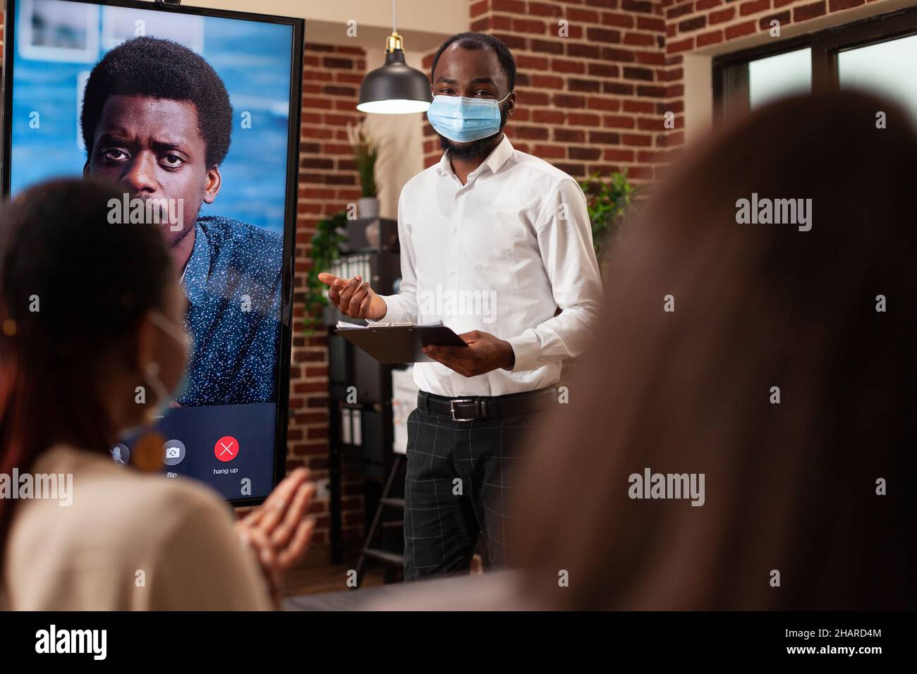 African american leader with medical face mask against covid19 ...