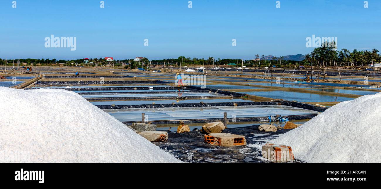 Between two piles of salt is a open field of salt flats Stock Photo - Alamy