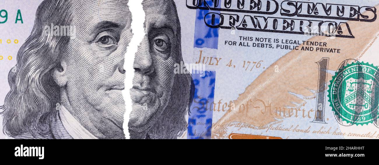 Closeup shot of torn hundred dollar note with a portrait of Benjamin ...