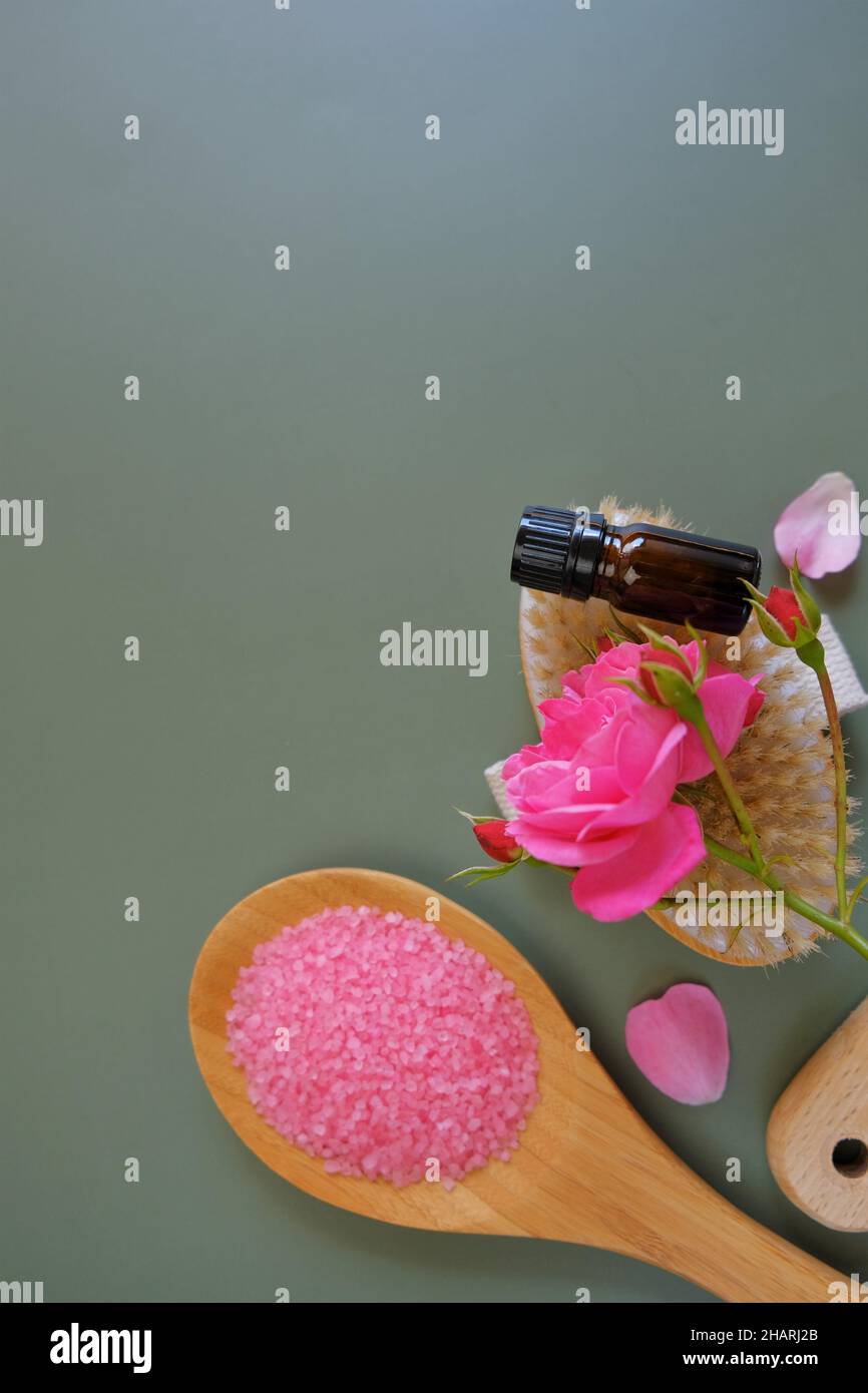 Rose essential oil and cosmetics salt with rose extract. Glass bottles ...