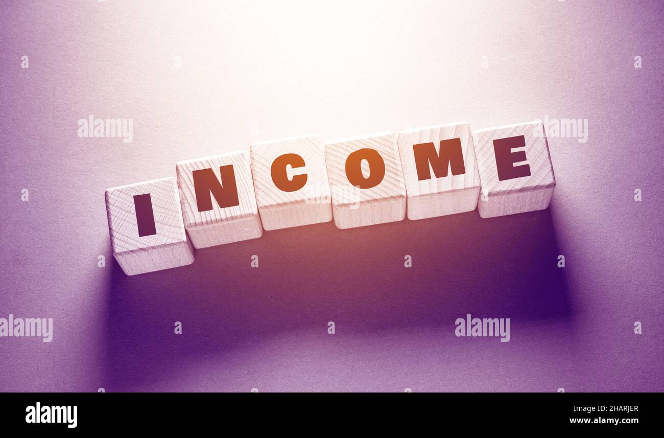 Income Word Written on Wooden Cubes Stock Photo - Alamy