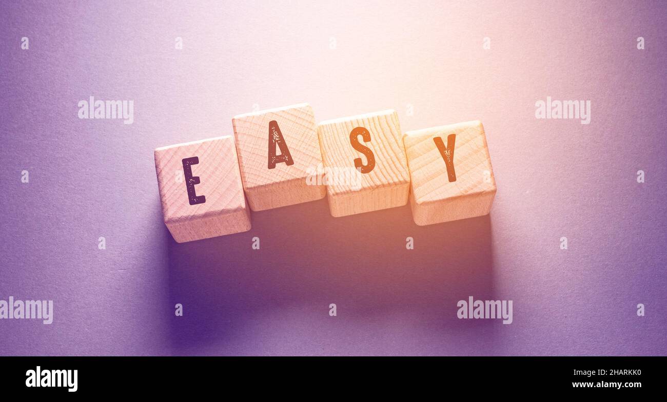 Easy Word Written on Wooden Cubes Stock Photo - Alamy