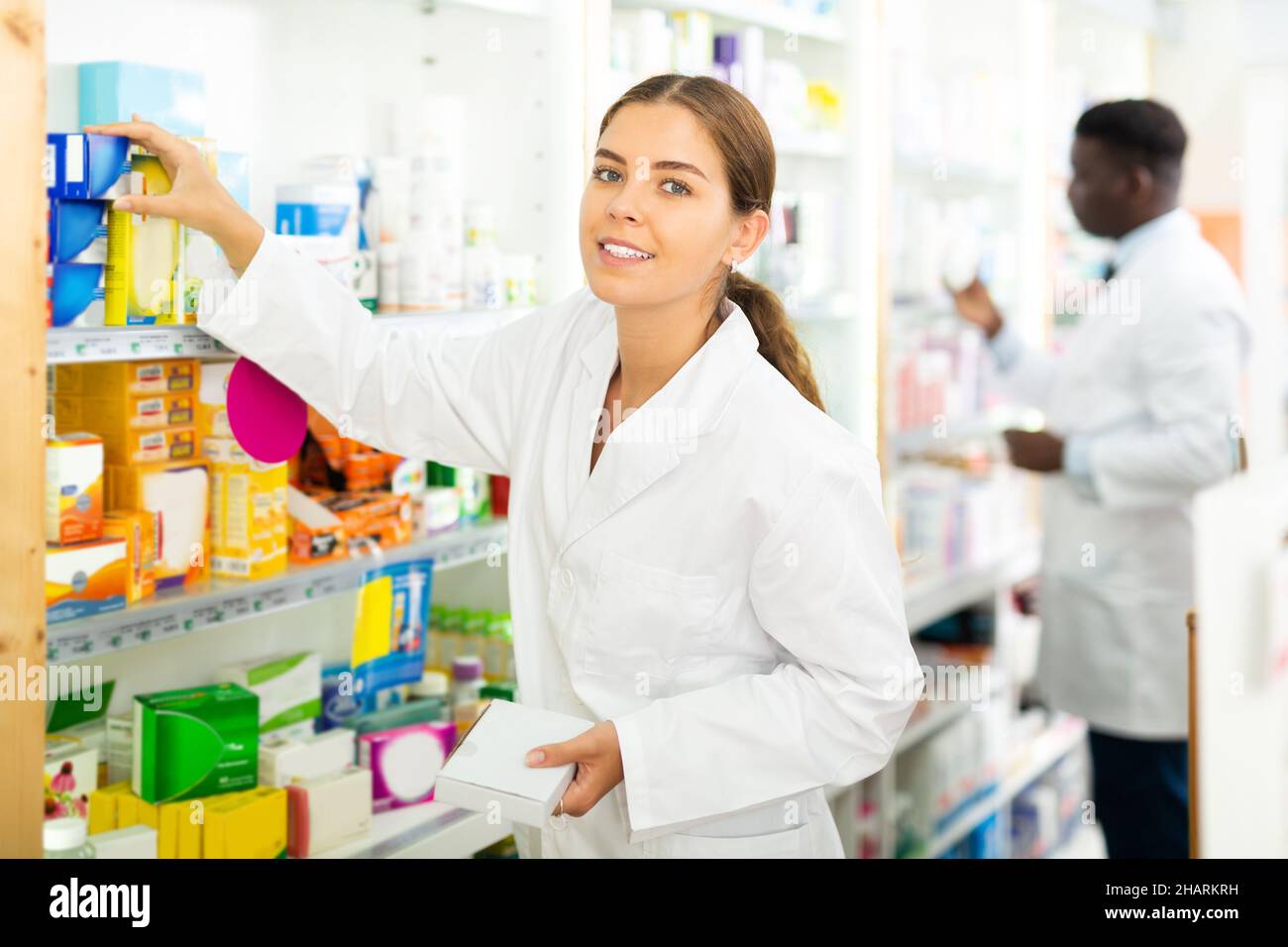 Pharmacists putting drug packages in order Stock Photo - Alamy