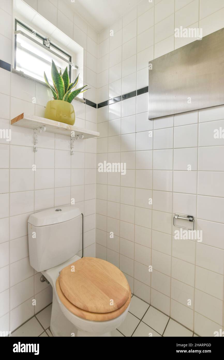 Interior of small clean restroom in miniature style Stock Photo - Alamy
