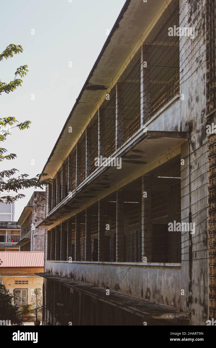 Vertical shot of the exterior of the prison with windows covered by ...