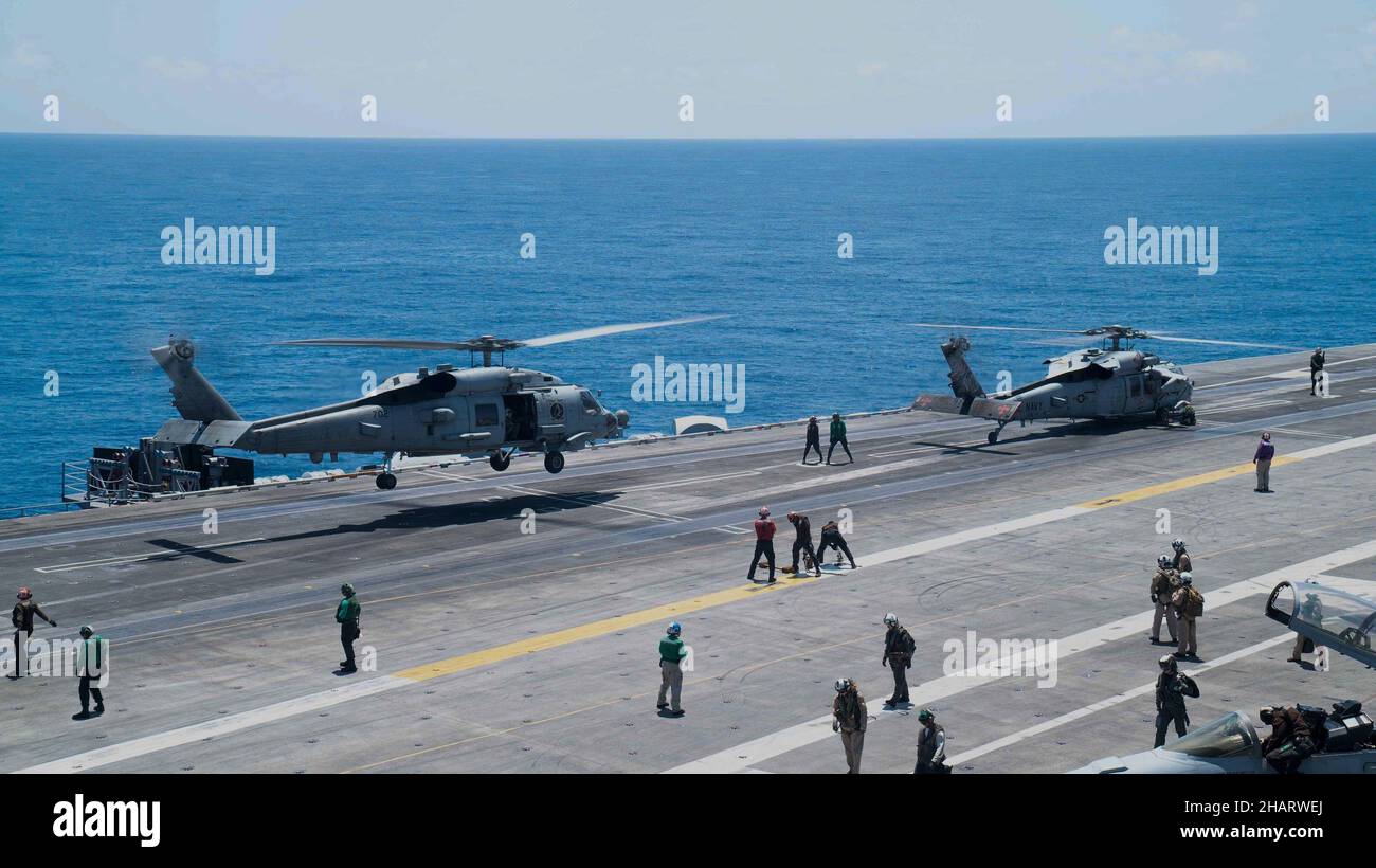 211211-N-PV401-1046 SAVU SEA (Dec. 11, 2021) An MH-60R Sea Hawk ...