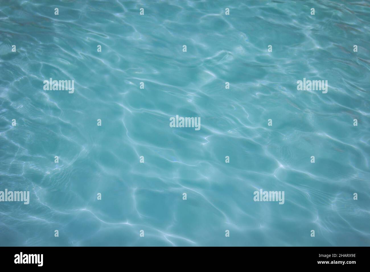 swimming pool with sunny reflections background Stock Photo - Alamy