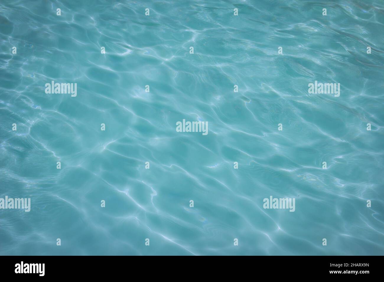 swimming pool with sunny reflections background Stock Photo - Alamy