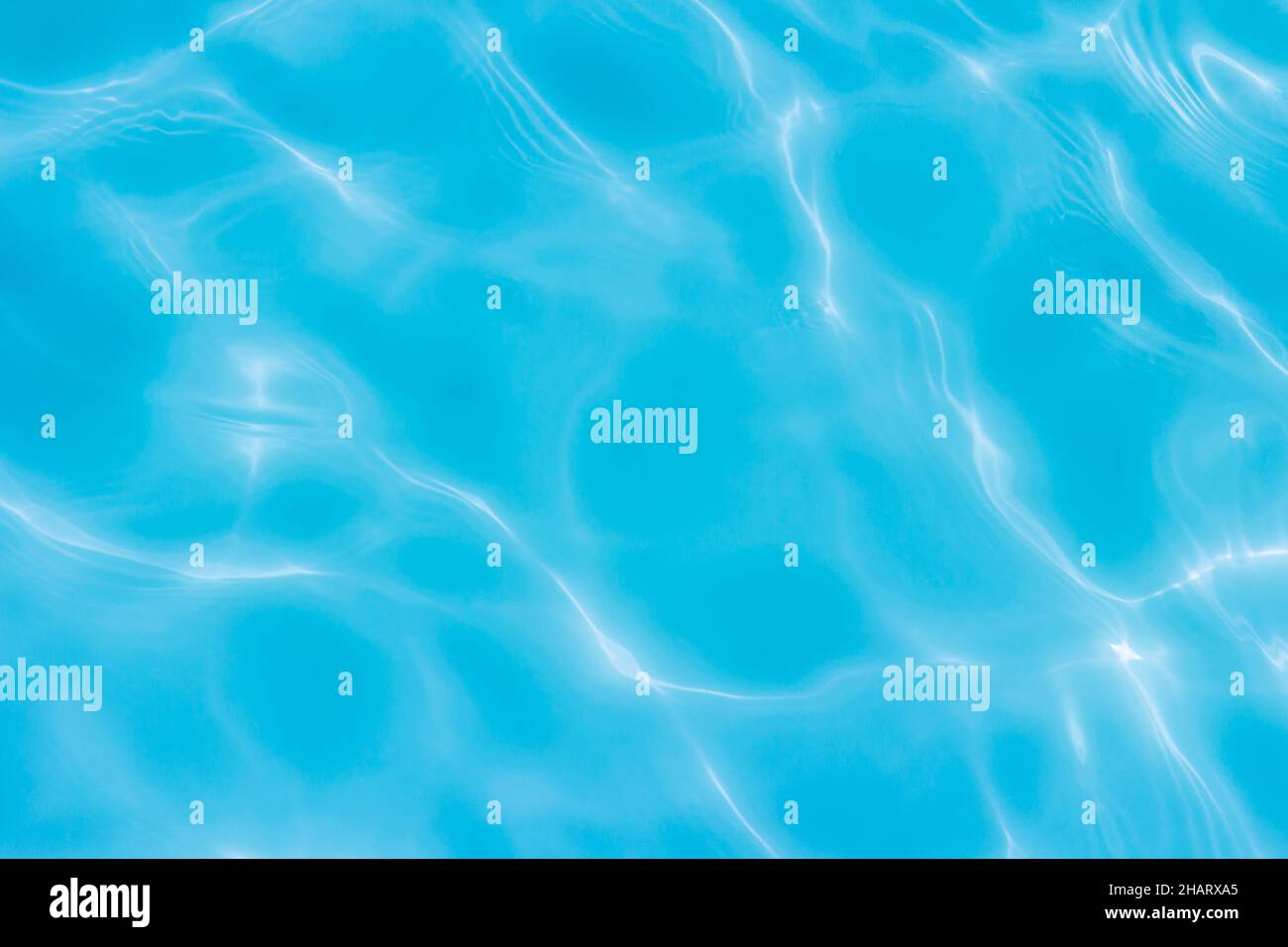 swimming pool with sunny reflections background Stock Photo - Alamy