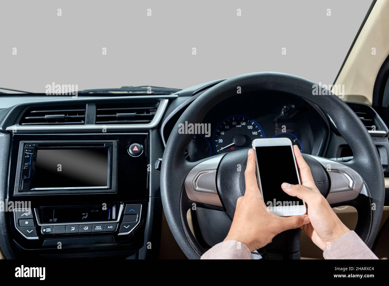 Man holding a mobile phone in the car Stock Photo - Alamy