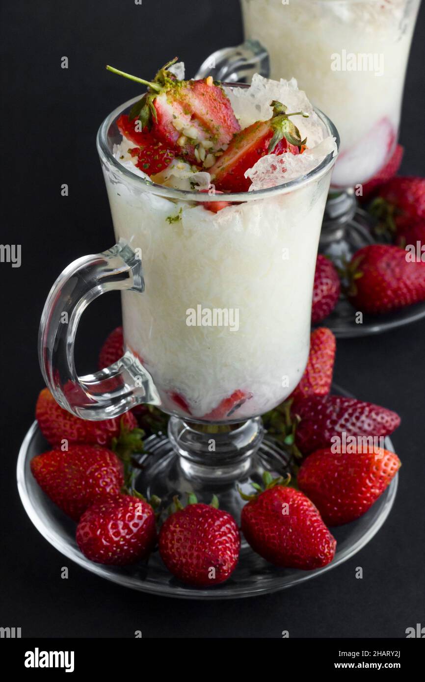 Traditional Turkish Ramadan Dessert;Gullac with strawberries in Latte ...