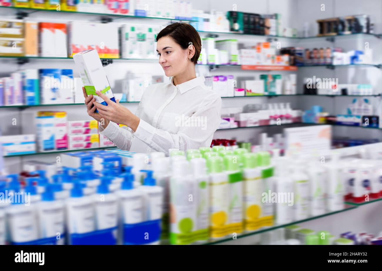 Beautiful female customer looking for products Stock Photo - Alamy