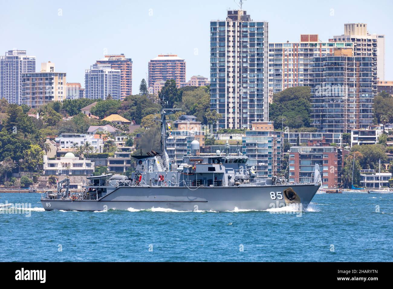 HMAS Gascoyne M85 a Huon class minehunter on Sydney harbour near garden ...