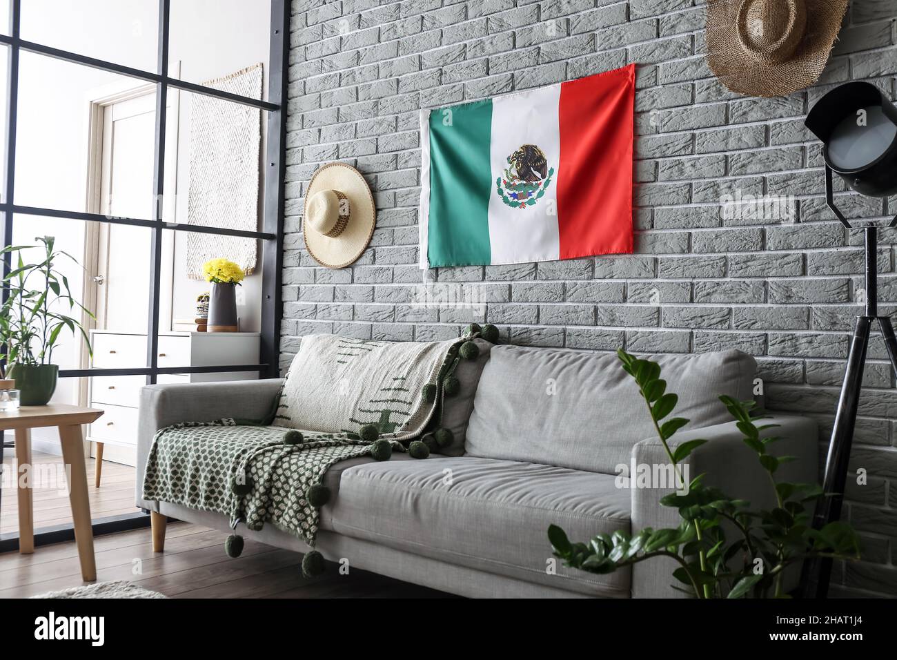 Interior of stylish room with Mexican flag on bricks wall Stock Photo ...