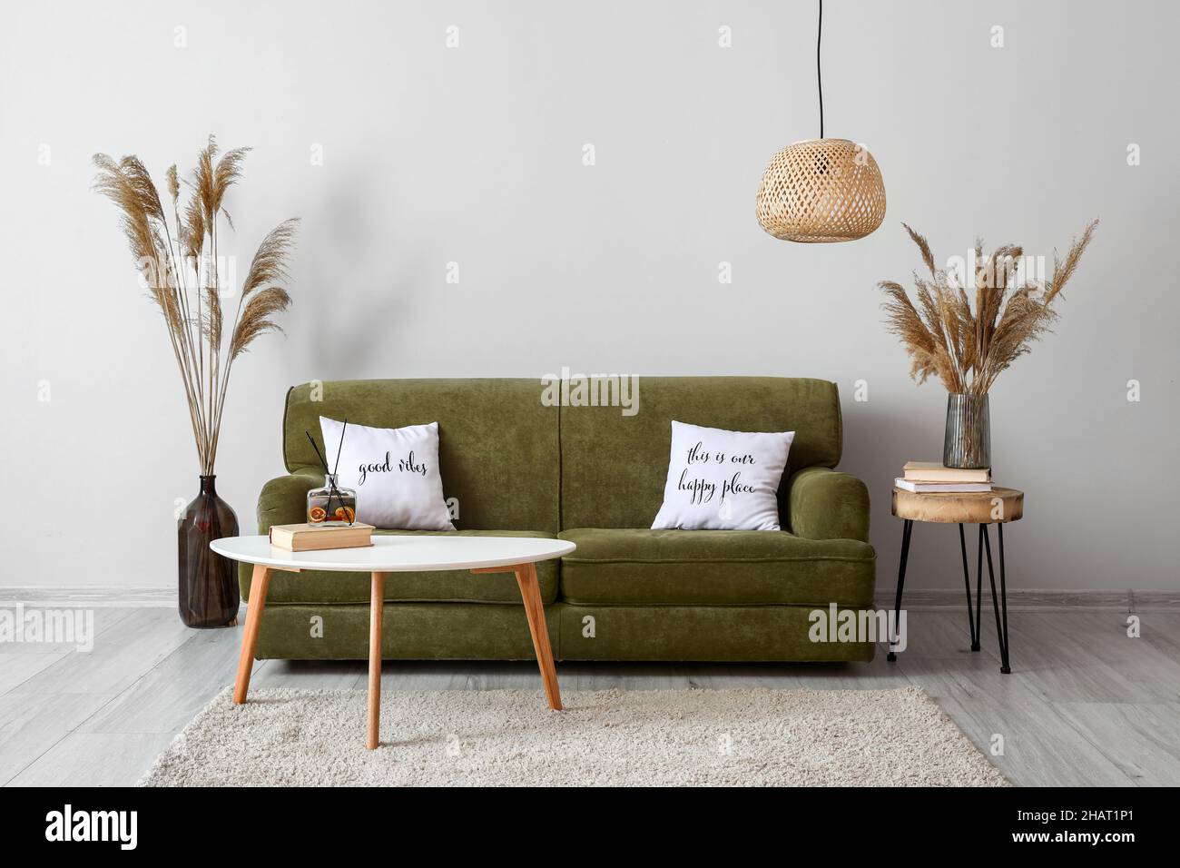 Interior of modern room with sofa and tables Stock Photo - Alamy