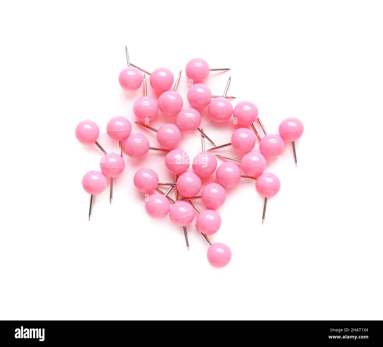 Pink paper pins on white background Stock Photo - Alamy