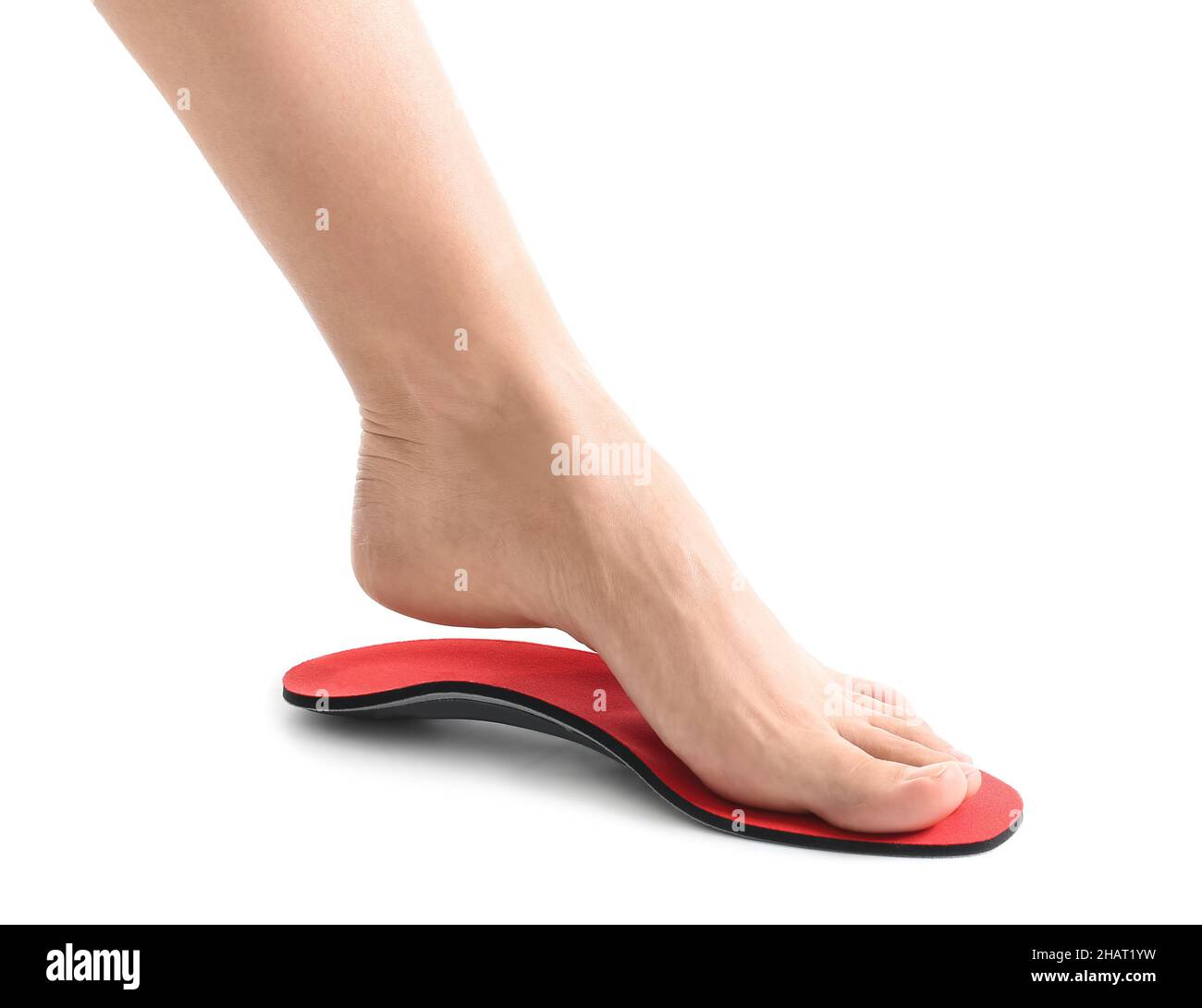 Female foot and red orthopedic insole on white background Stock Photo ...