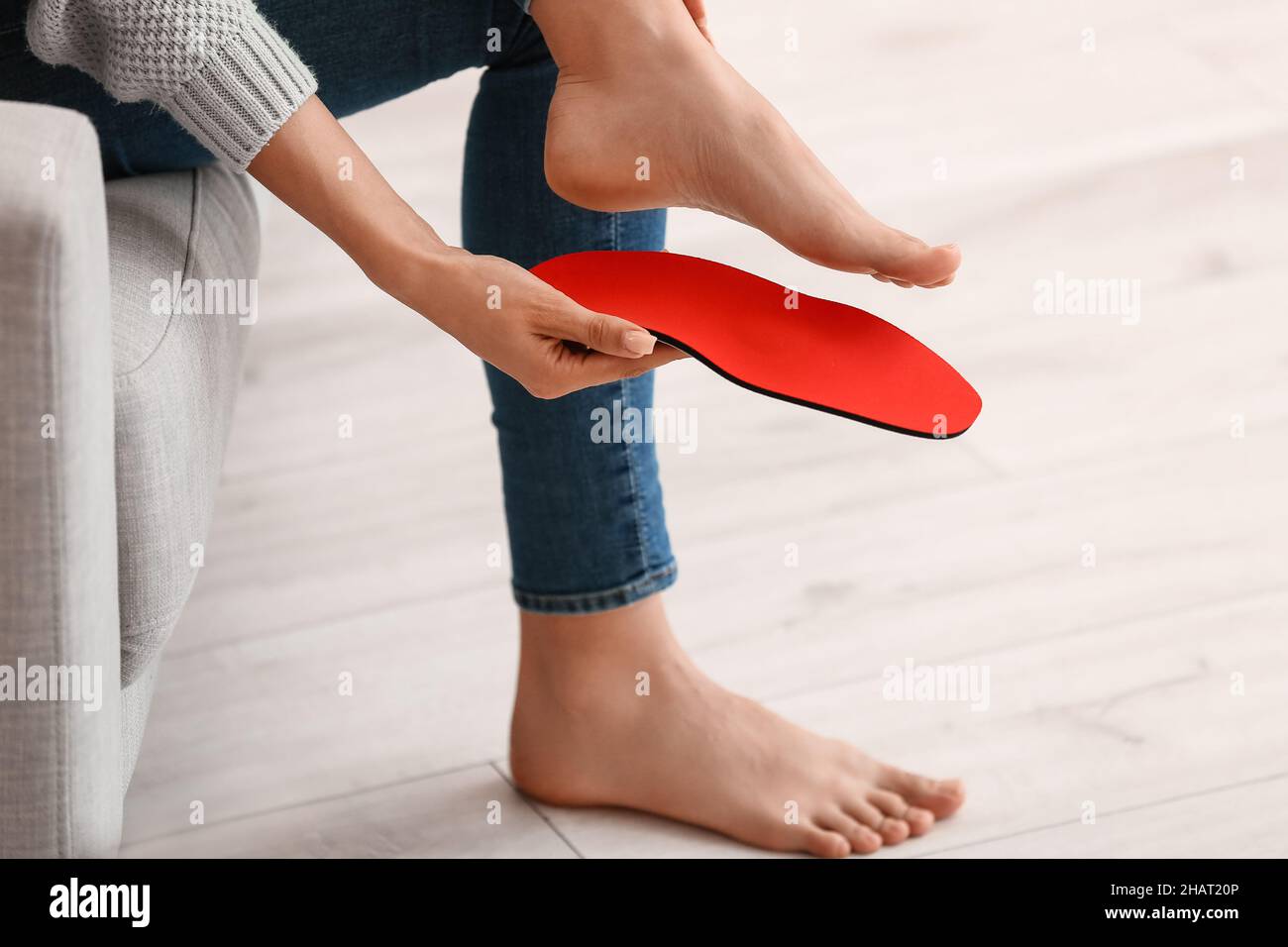 Woman fitting orthopedic insole hi-res stock photography and images - Alamy