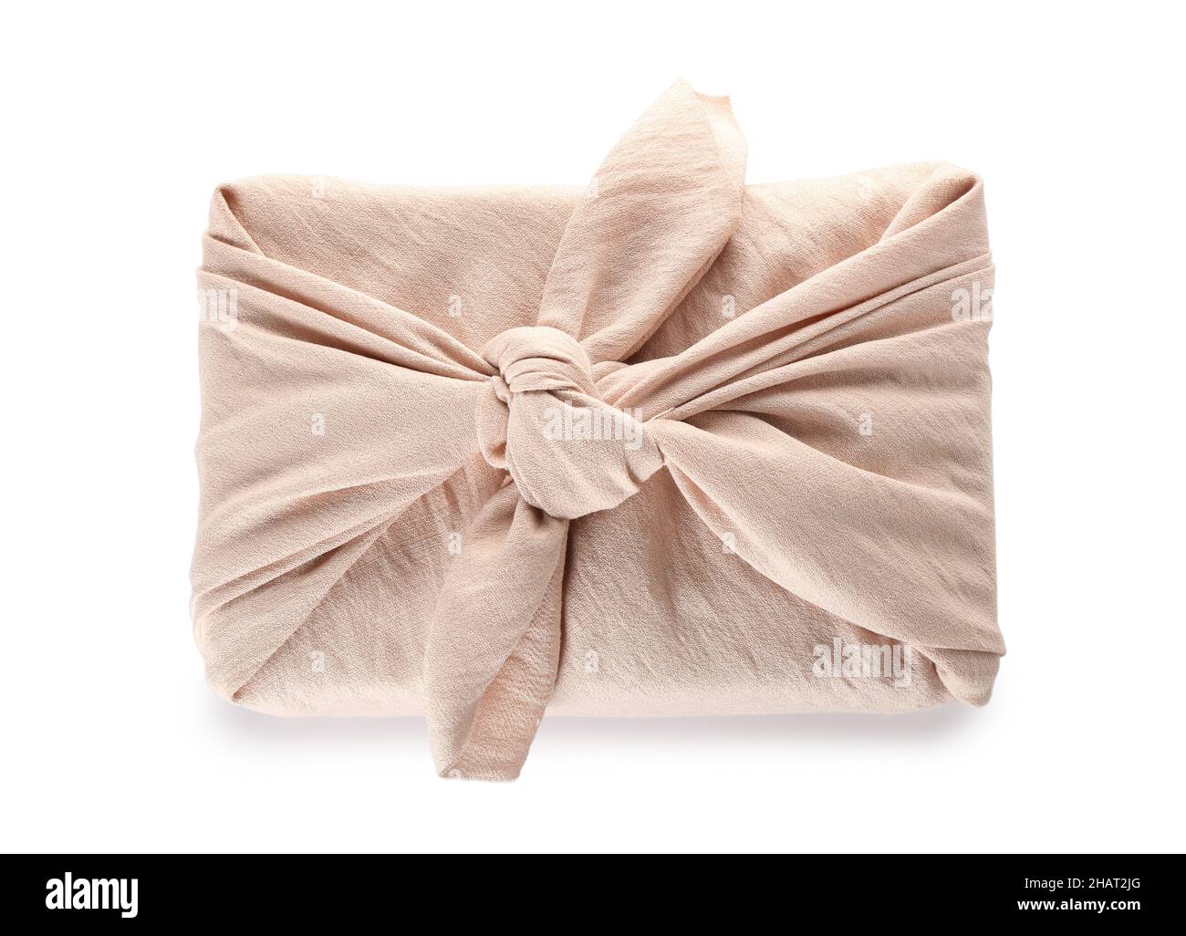 Gift box wrapped in cloth on white background Stock Photo - Alamy