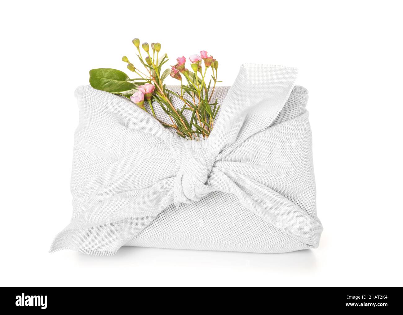 Gift box wrapped in cloth with flowers on white background Stock Photo ...