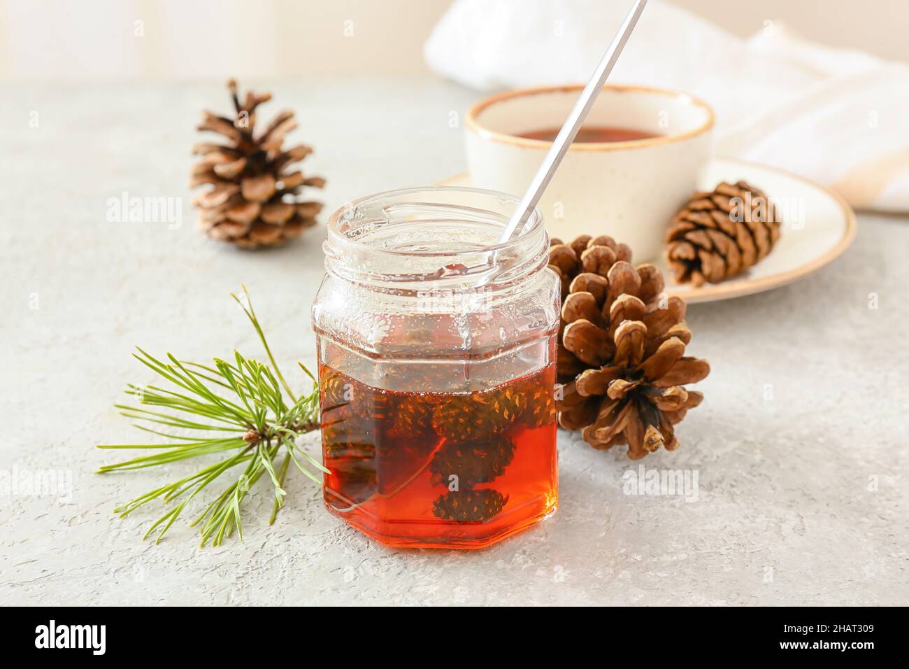 Jar of tasty pine cone jam on light background Stock Photo - Alamy