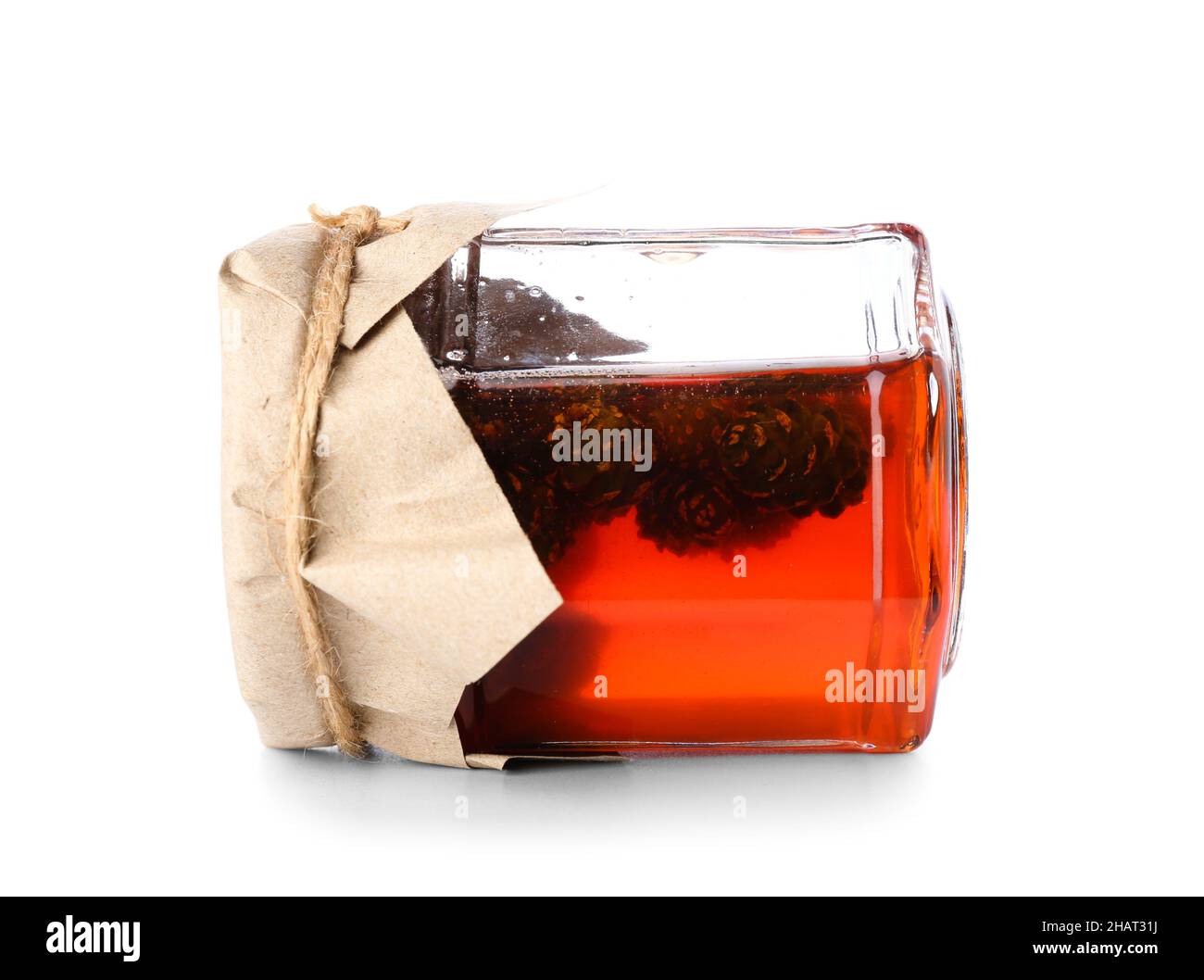 Jar of tasty pine cone jam on white background Stock Photo - Alamy