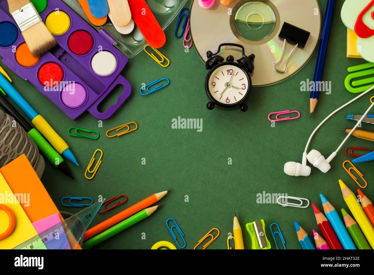 Colorful school supplies on greenboard with copy space.and mini vintage ...