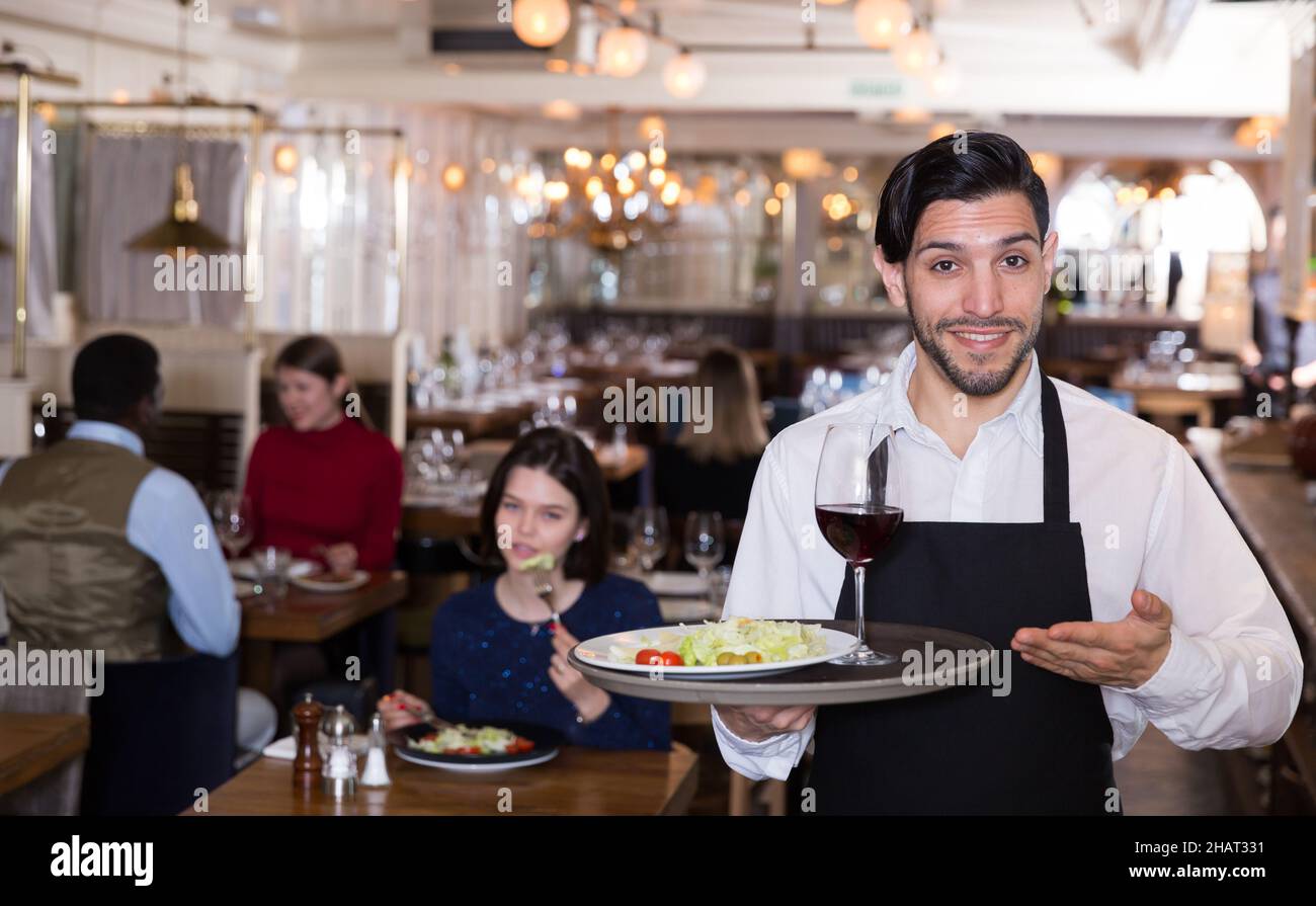 Confident waiter holding serving hi-res stock photography and images ...