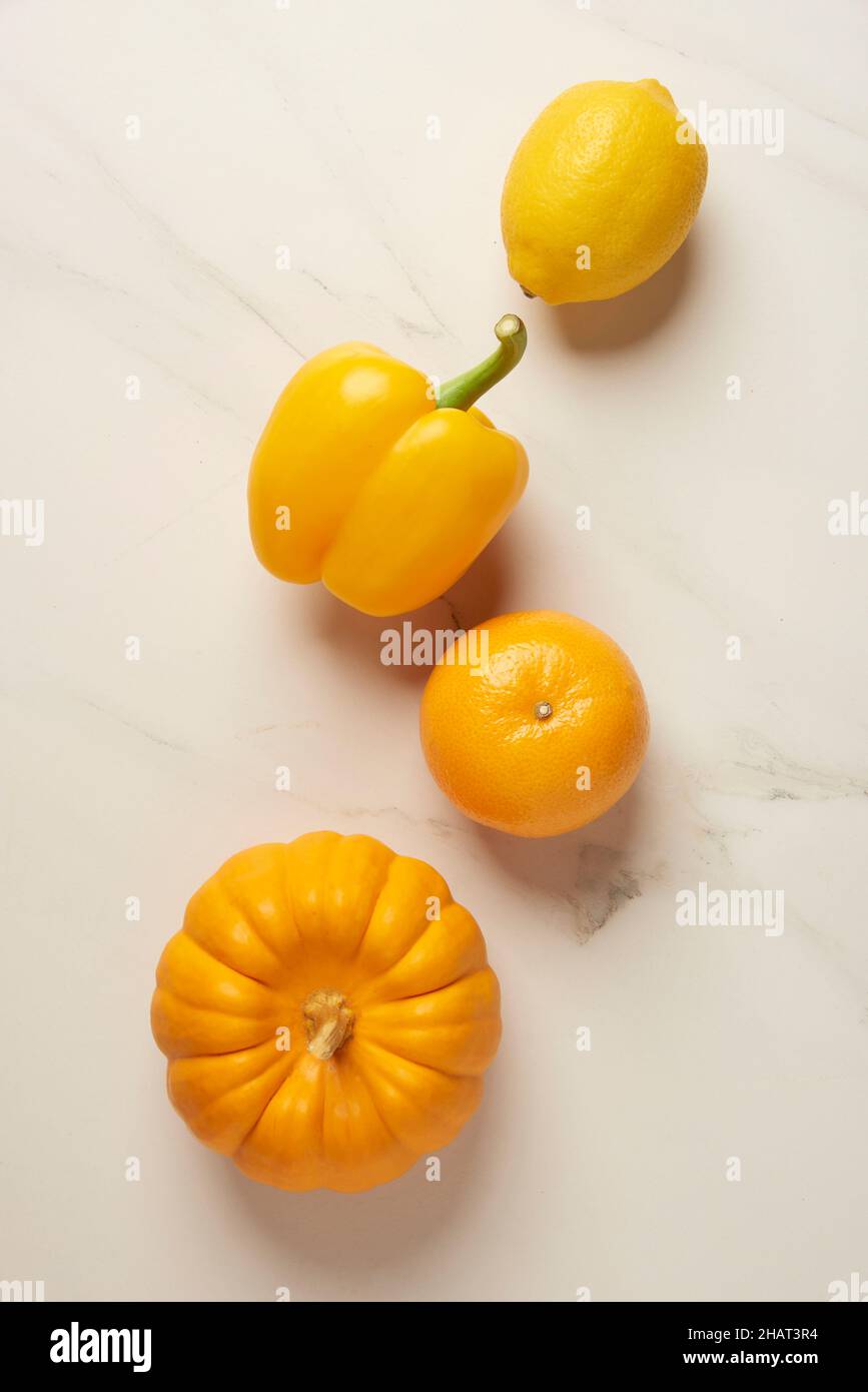 vegetable concept a few yellow and orange vegetable sorted together on ...