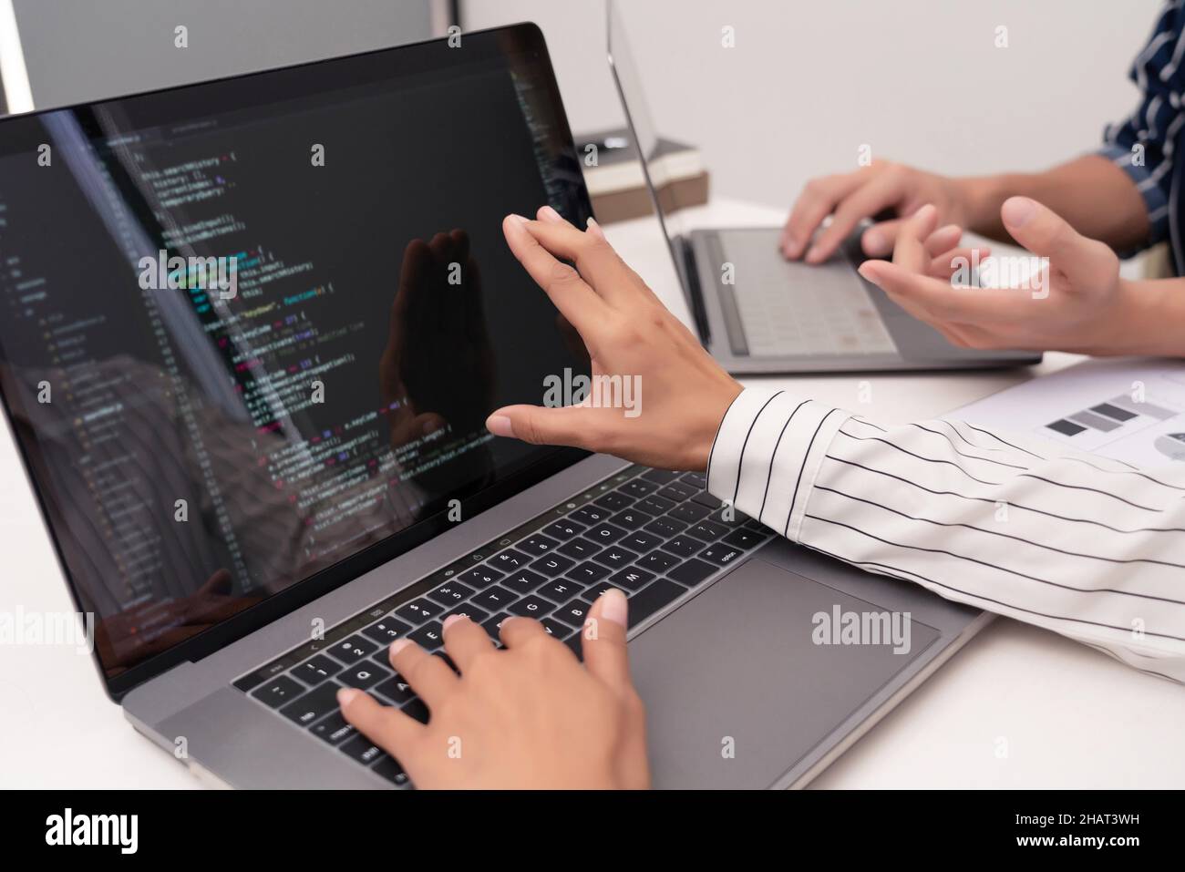 co-working concept the co-workers sitting next to each other, looking ...